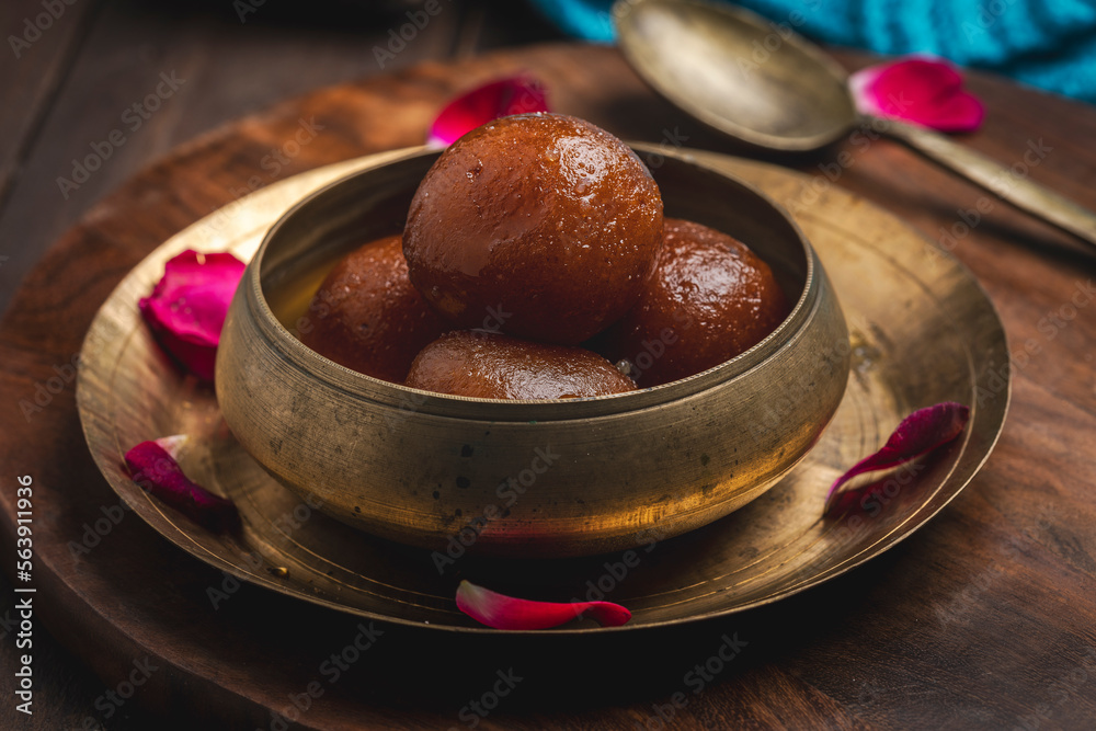 Gulab jamun is made with deep-fried balls of milk base dough soaked in ...