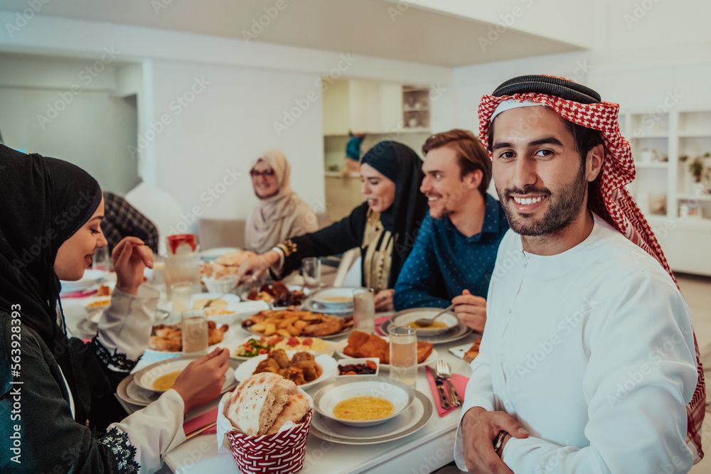 Muslim family having Iftar dinner drinking water to break feast. Eating ...