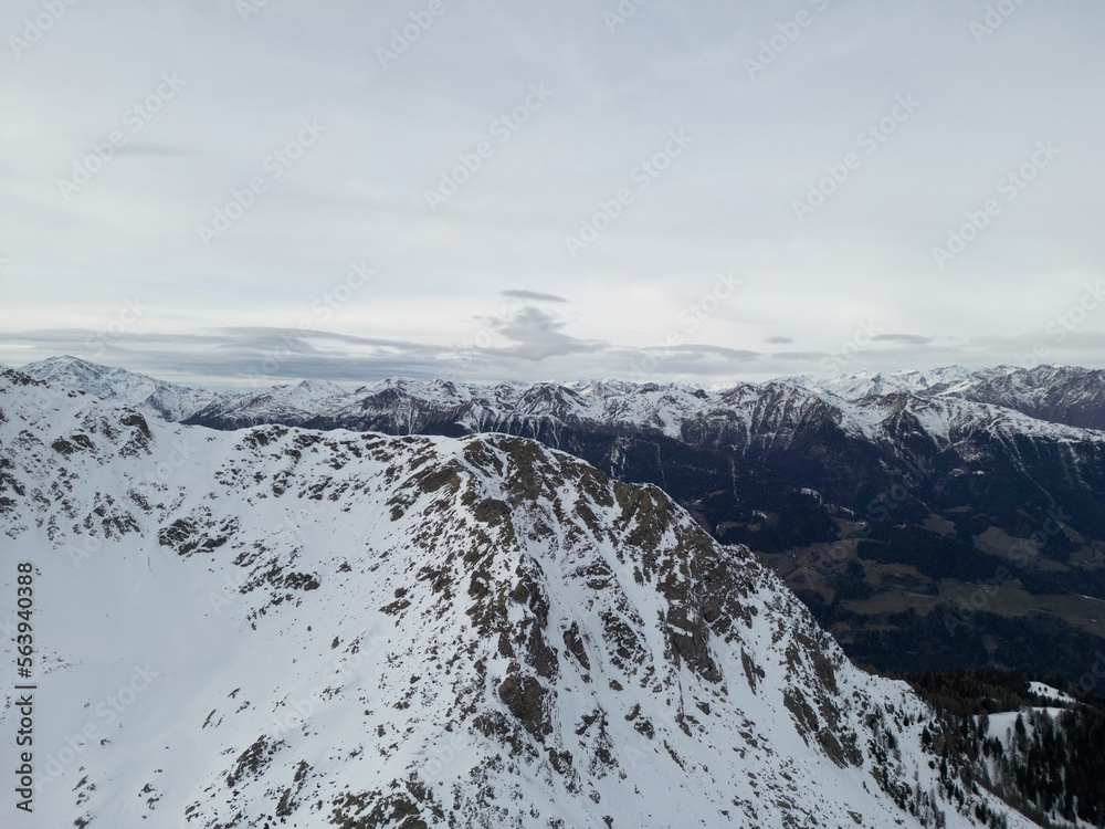 Stunning high view mountain landscape framed by a blue sky with clouds ...
