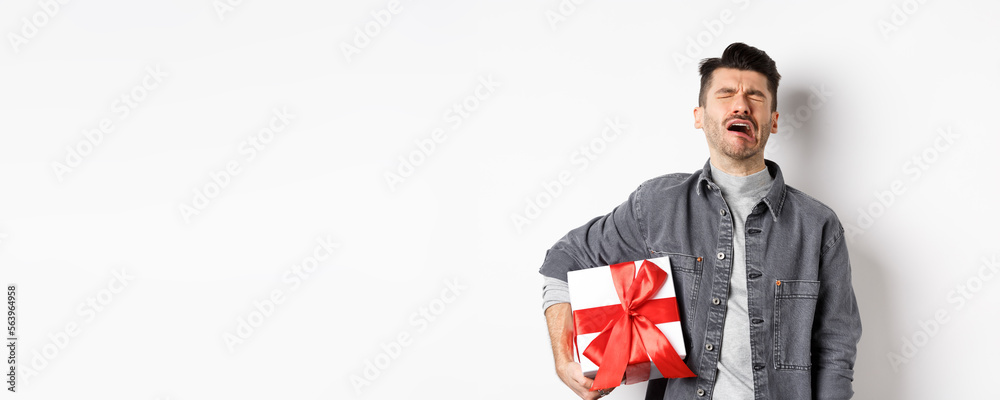 Valentines day heartbreak. Single and heartbroken guy crying lonely ...