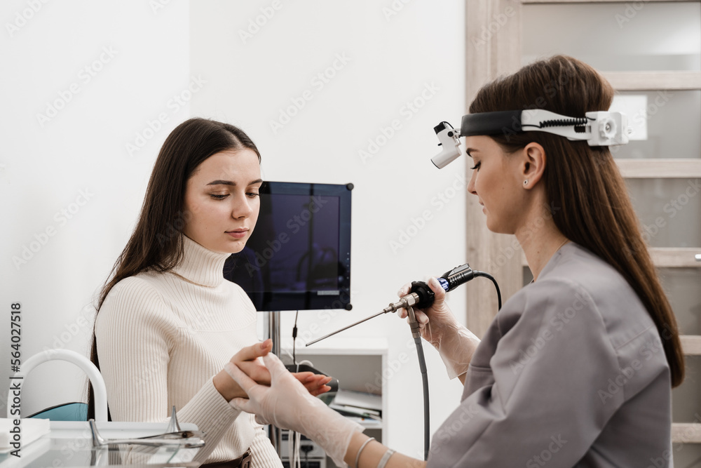 Doctor otolaryngologist with rhinoscope for endoscopy. Consultation ...