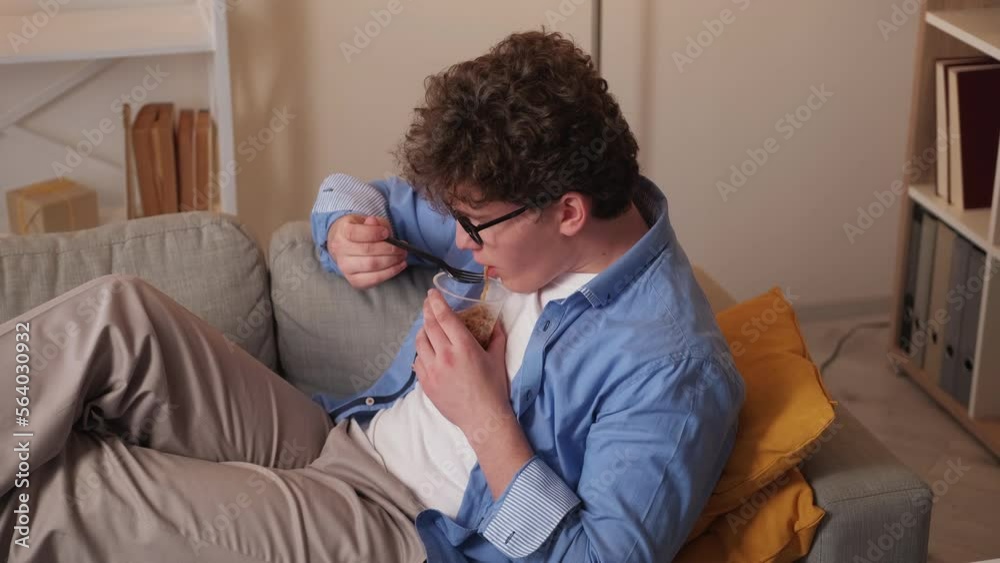 Fast food soup. Depressed man. Poor dinner. Gloomy casual guy eating ...