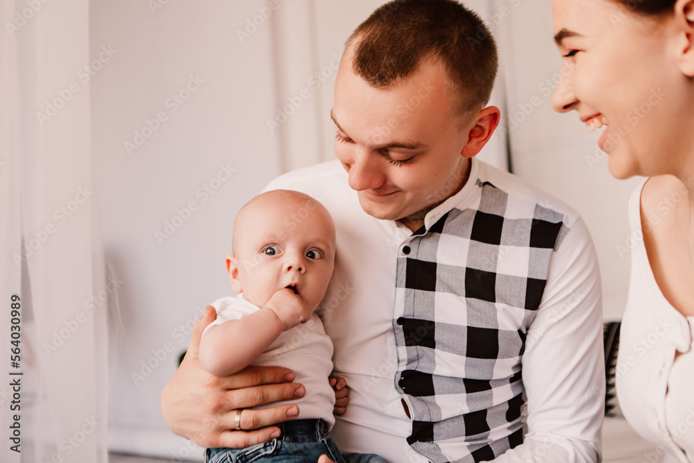 Little boy pop-eyed surprised cute child baby playing with parents ...