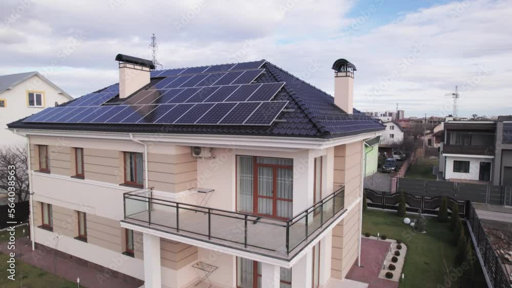 Video footage of modern house with solar panel modules for generating ...