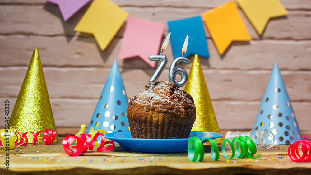 Festive cake with a candle with a number 76. Happy birthday background ...