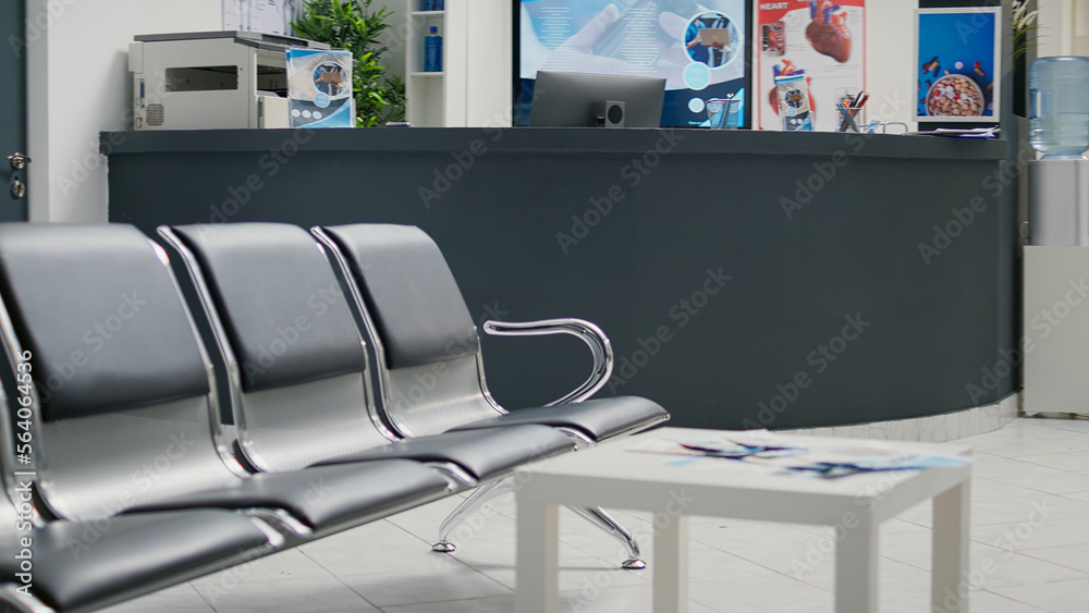 Medical clinic reception counter with waiting room in lobby, hospital ...