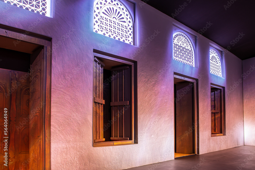 Arabic style window portals and carved wooden doors with arabesque ...