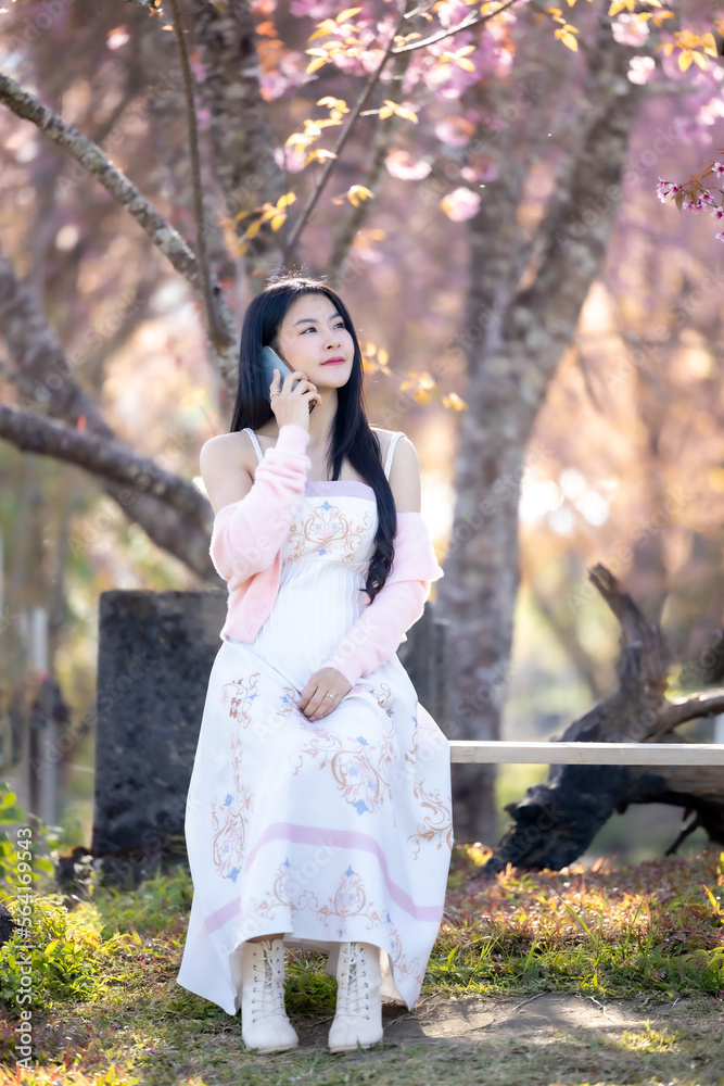 Beautiful woman using smartphone, talking, typing message, chatting ...