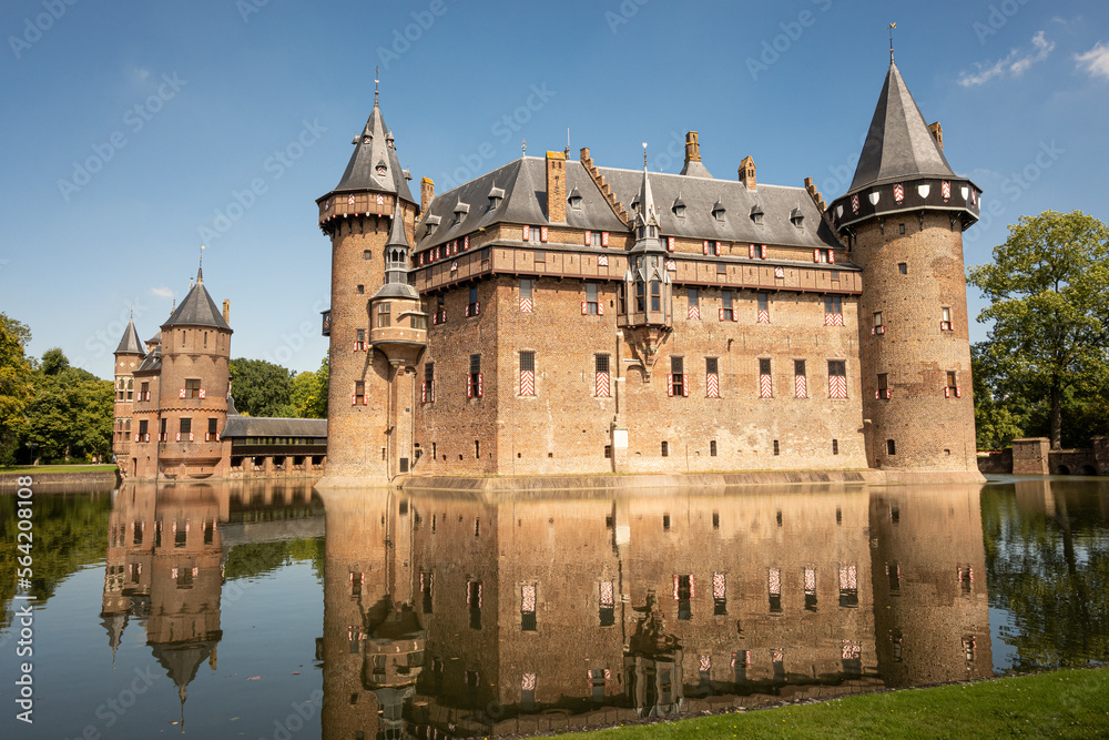 outside of Kasteel De Haar Dutch medieval castle reflection in moat on ...