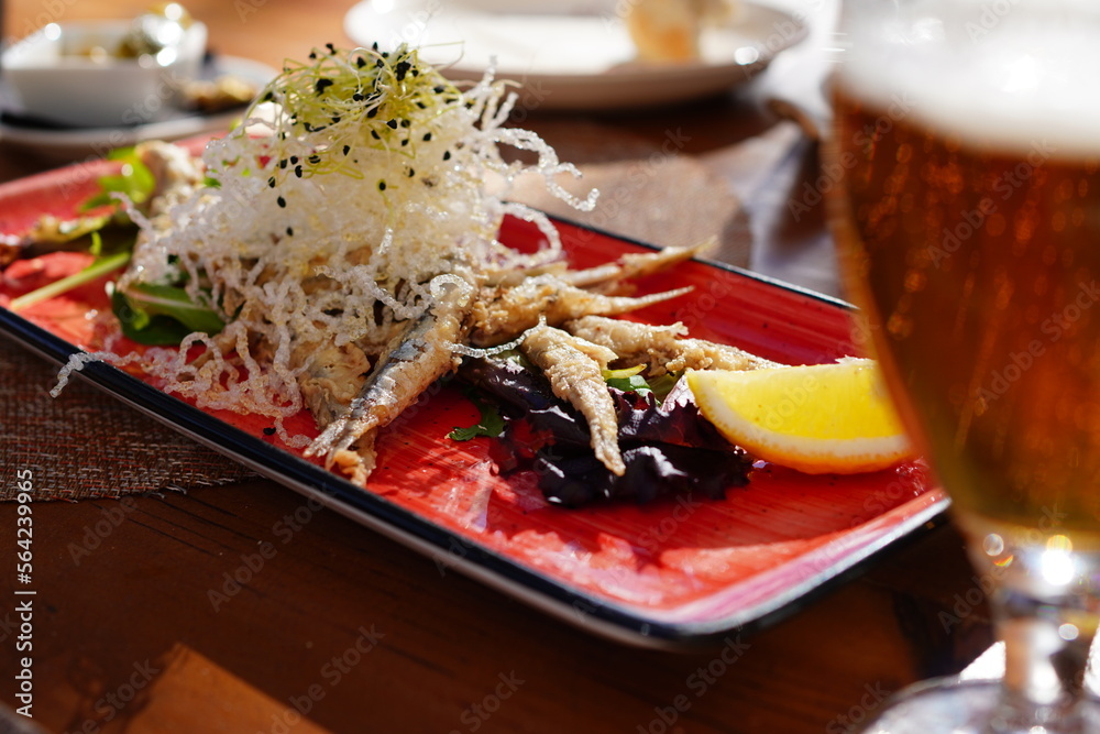 Boquerones fritos, typical Spanish tapas, Spanish fried anchovies Stock ...