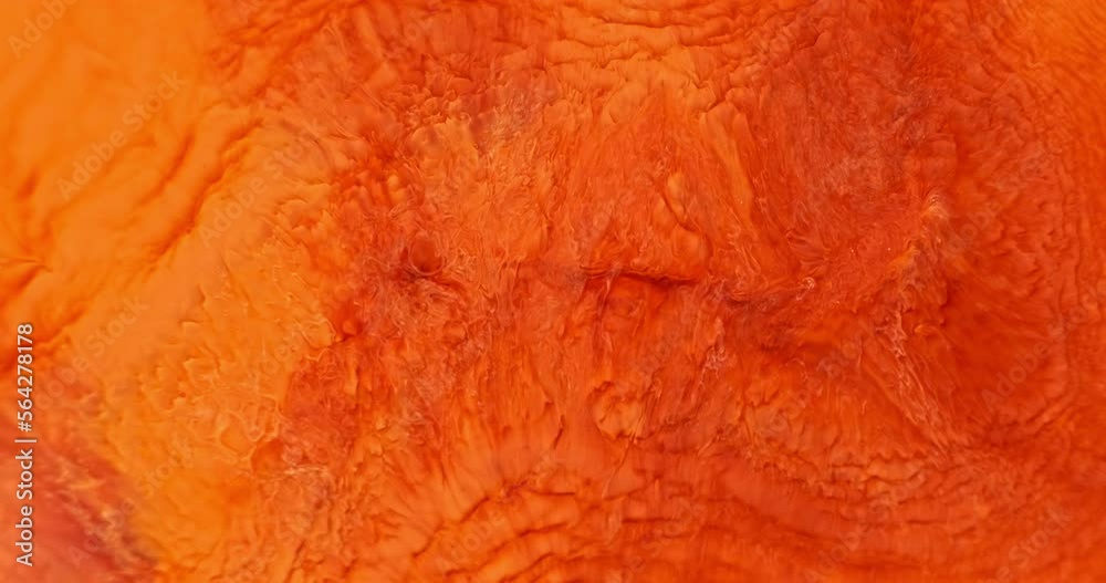 Bright orange paint splash in abstract wave. Red orange color ink ...