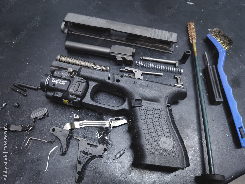 Dismantling and cleaning the Glock 19 pistol. Baltic states, January ...