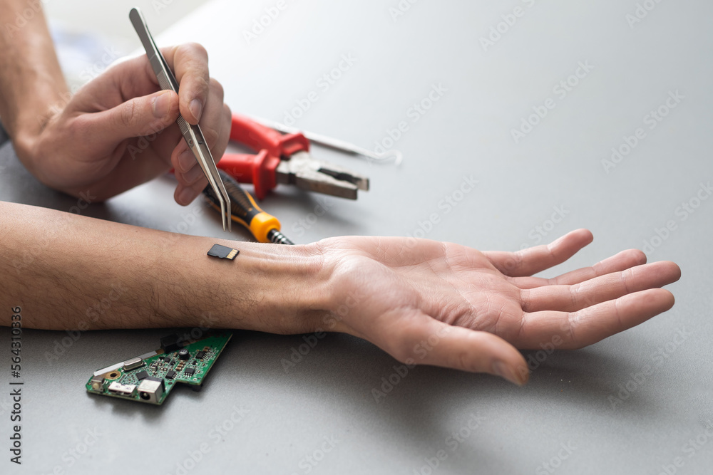 Robot arm concept. Man shows biomechanical prosthetic hand. Guy repairs ...