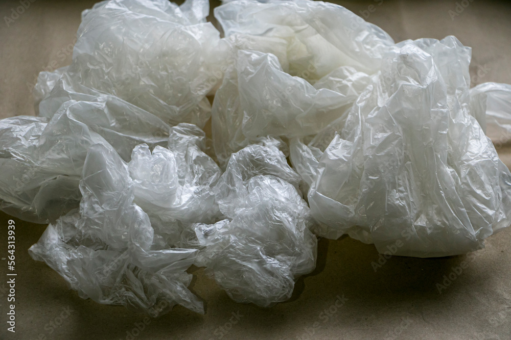 Pile of used plastic disposable bags. White disposable plastic bags ...