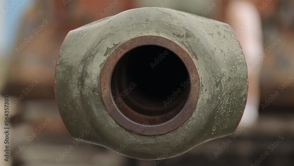 Tank gun, barrel muzzle of a military army close-up. Broken burnt tank ...