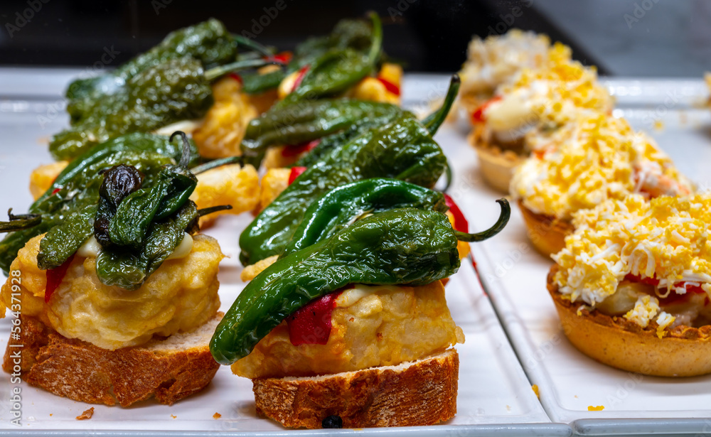 Typical snack of Basque Country, pinchos or pinxtos, small piece of ...