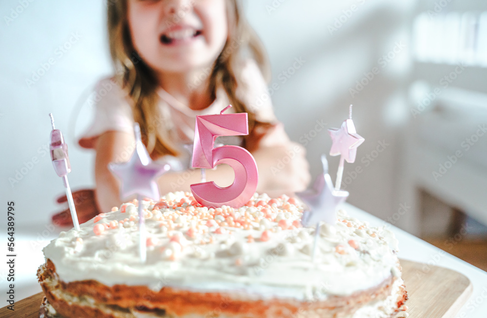 Big pink 5 number candle on homemade cake. Creative congratulations on ...