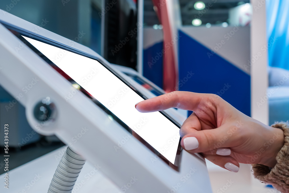 Woman hand using white blank interactive touchscreen display of ...