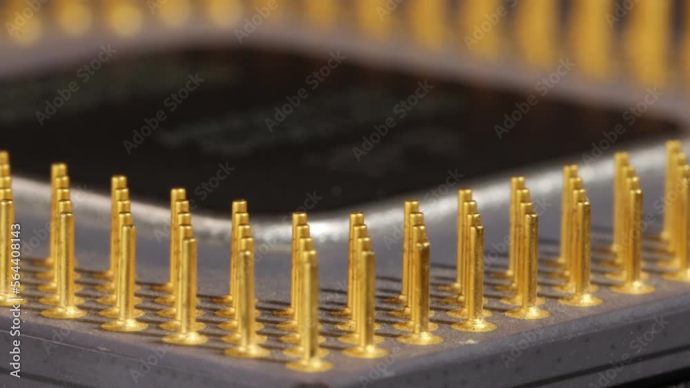 CPU, Brains of the Computer. Close up showing the hundreds of golden ...