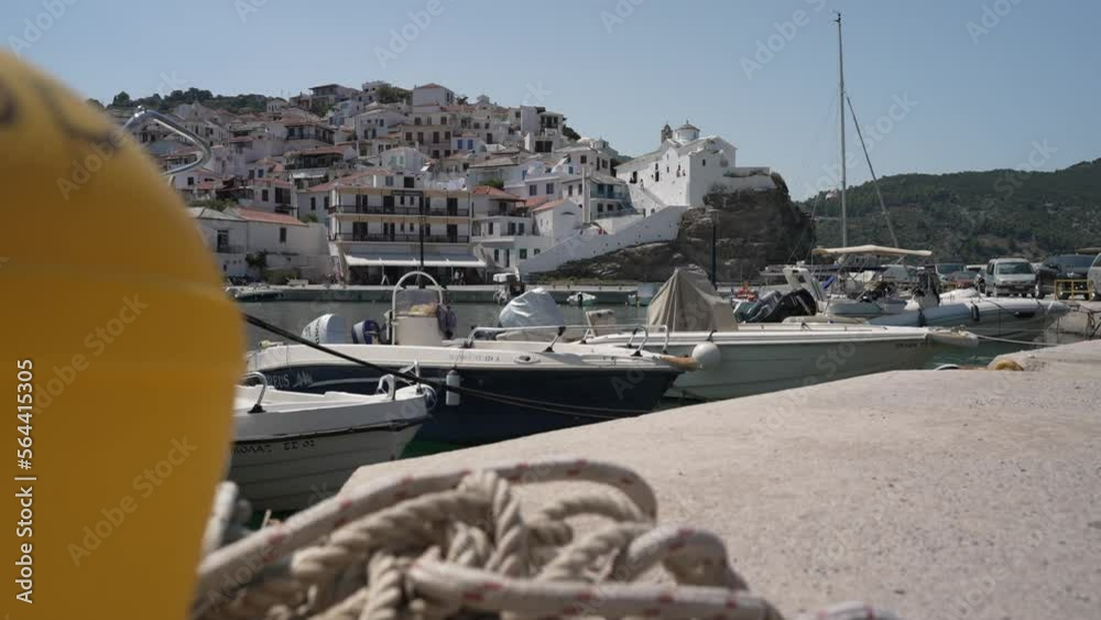 Marina boats and whitewashed Old Town buildings, Skopelos Town ...