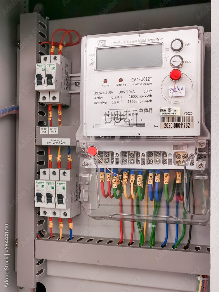 Image of digital kilowatt hour meter mounted in electrical cabinet ...