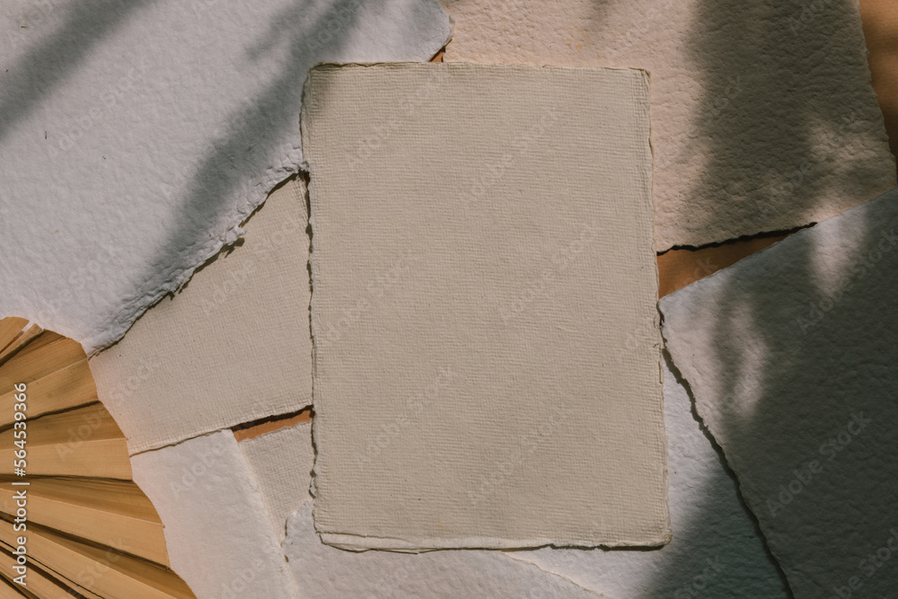 Handmade cotton rag deckle edge paper cards on beige background with ...