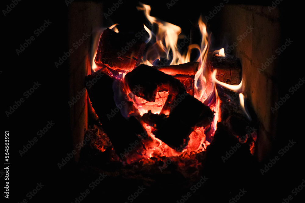 fire burns in the fireplace. Fireplace with flame fire ashes. burning ...