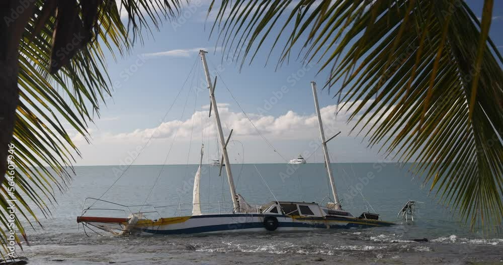 St Maarten Caribbean hurricane destroyed sunk sailboat. Tropical rocky ...