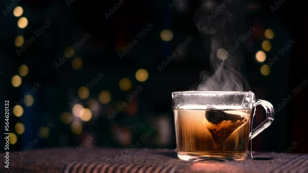 Tea leaves leaching out in hot water. Fresh steaming rooibos or black ...