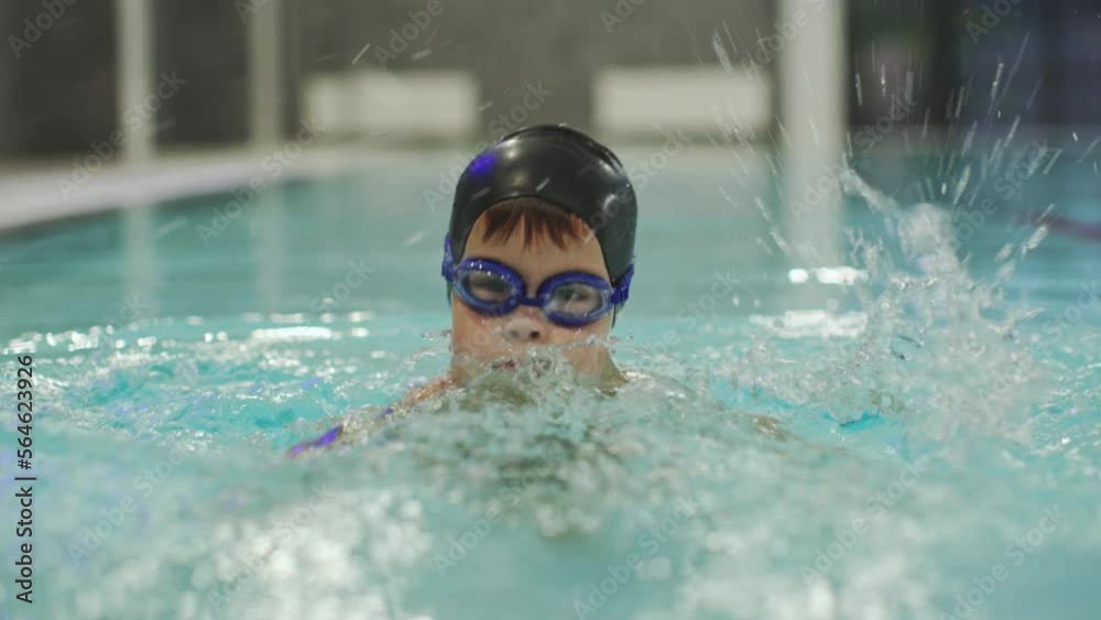 children swimming class indoor pool male child kid boy learning to swim ...