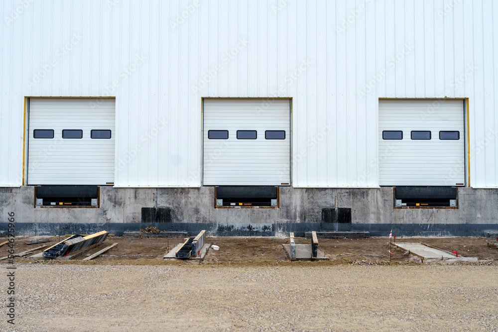 Sectional gates of the distributed center. Warehouse gate for loading ...
