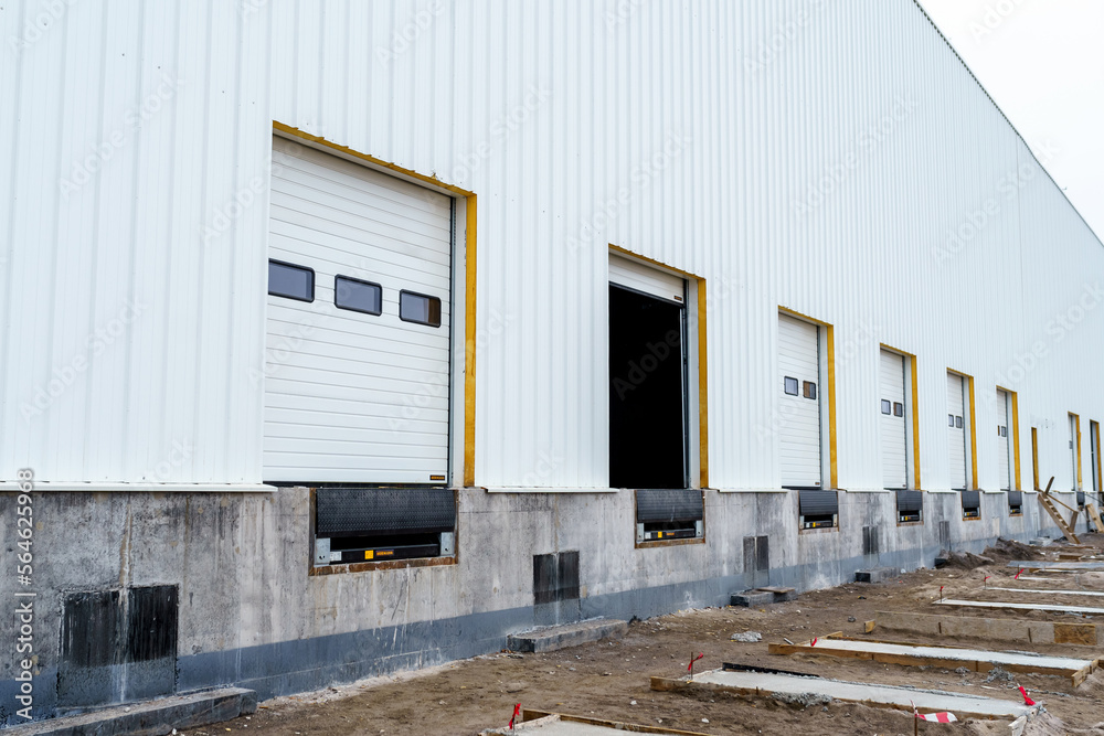 Sectional gates of the distributed center. Warehouse gate for loading ...