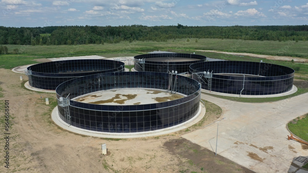 Large round metal tanks for storing liquid waste from an agricultural ...