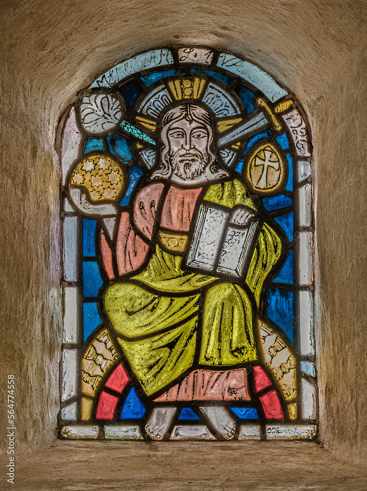 stained glass in a church wall depicting Jesus on the throne Stock ...