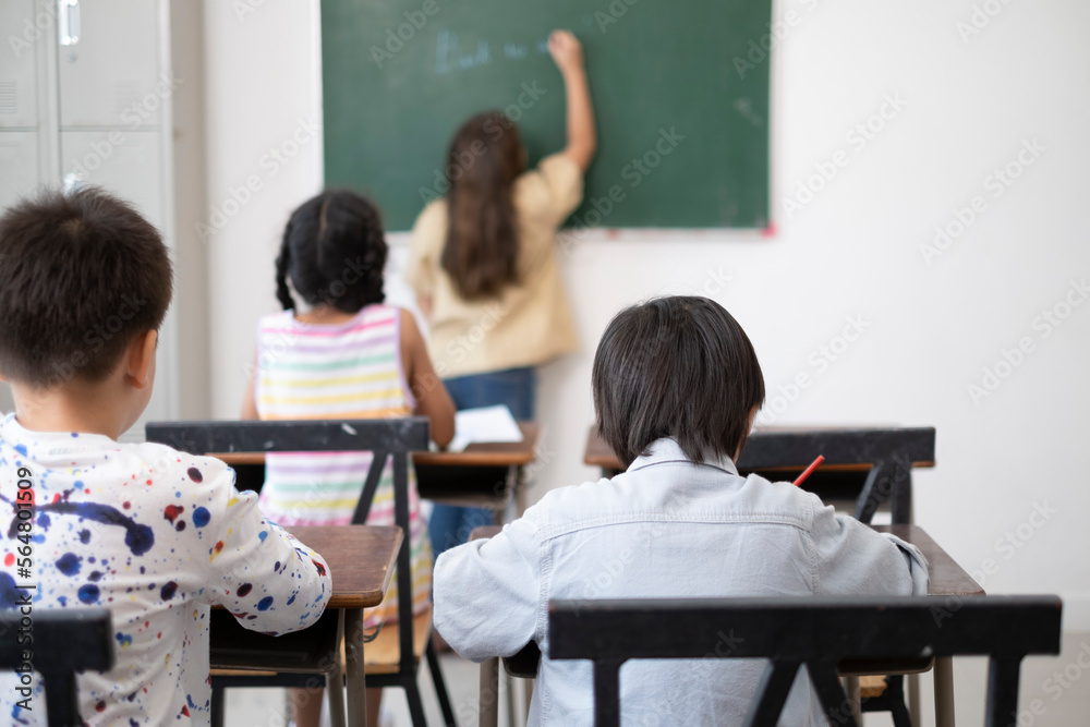 Cute Asian primary school students are concentrating and enjoying ...