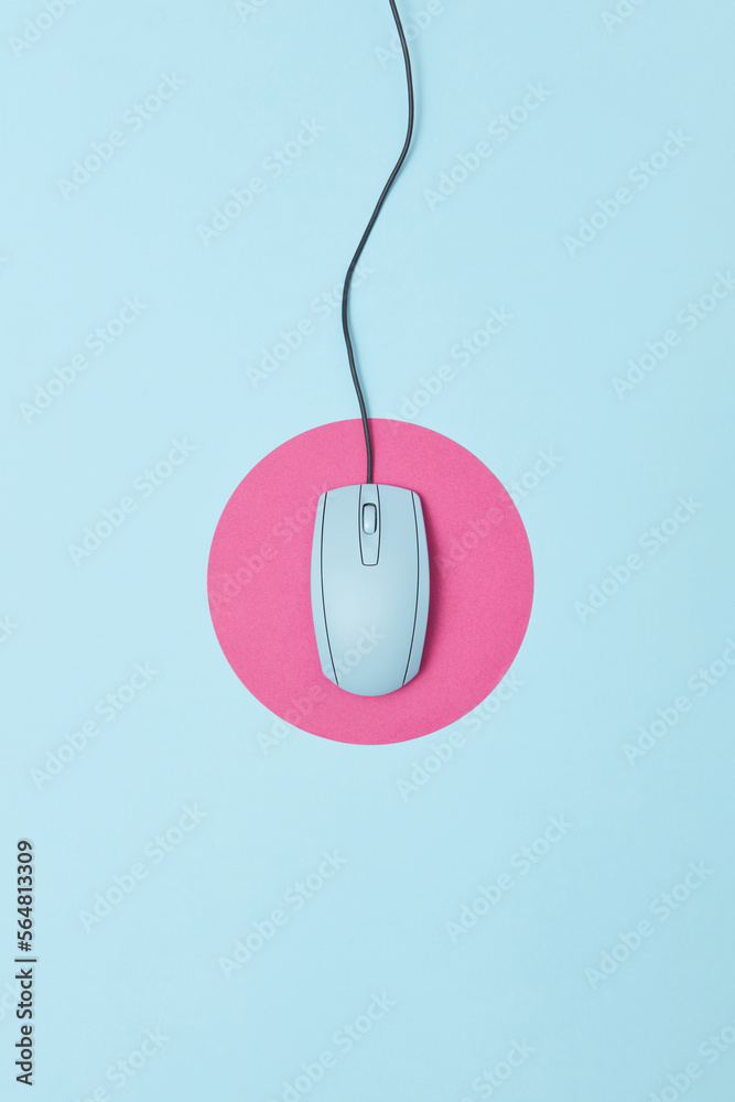 Vintage wired computer mouse on round pink pad. Stock Photo | Adobe Stock