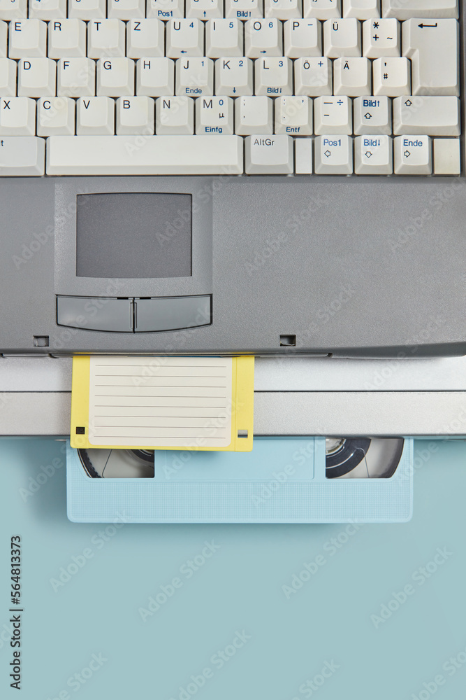 Retro laptop, VCR video player with VHS cassette. Stock Photo | Adobe Stock