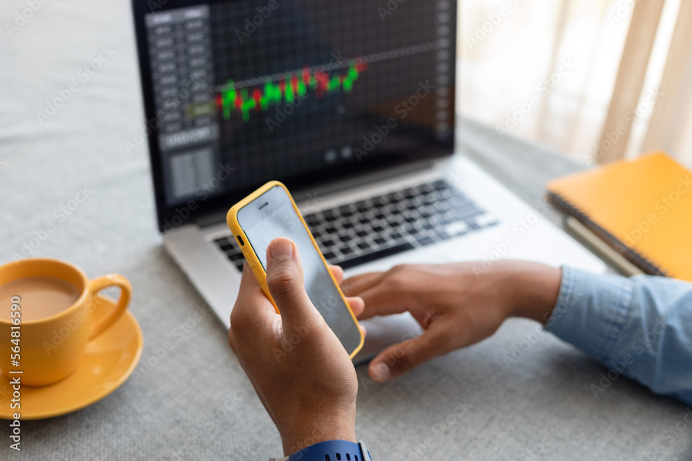 trader using phone Stock Photo | Adobe Stock