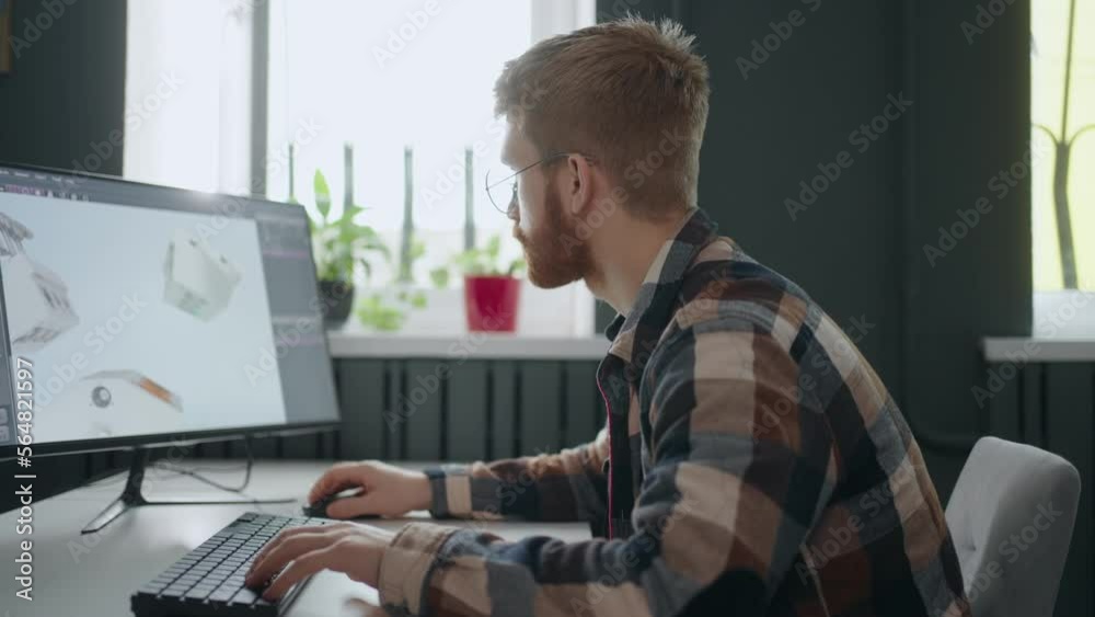 male creative designer using CAD system for projecting details of ...