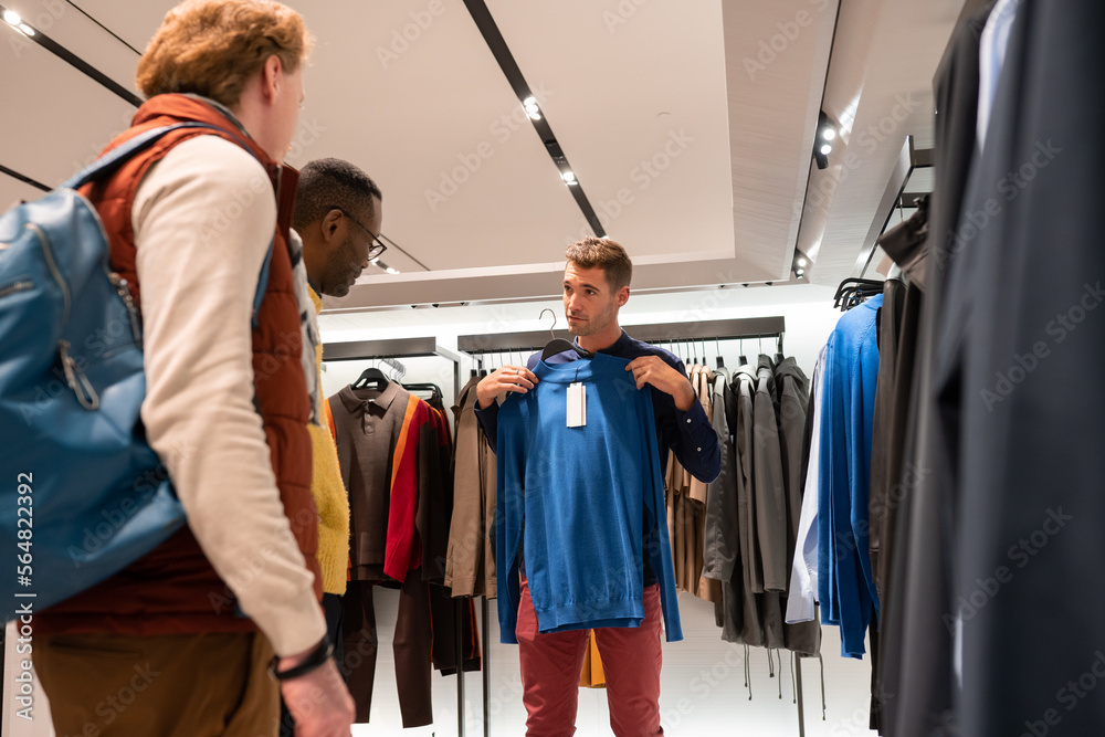 Men In Shop Of Clothes Stock Photo | Adobe Stock