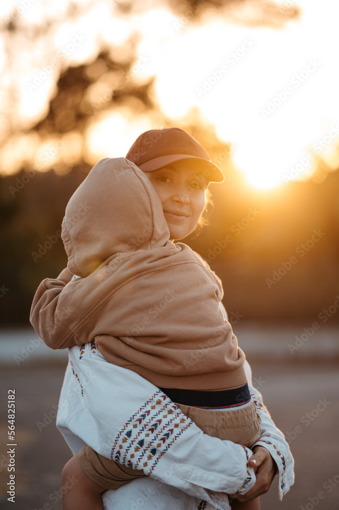 Mother hug son in sunset. Stock Photo | Adobe Stock