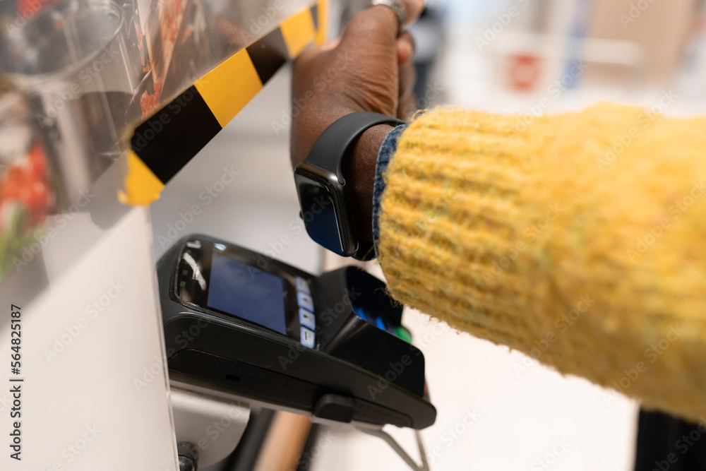 Paying At Supermarket Using Smartwatch Stock Photo | Adobe Stock