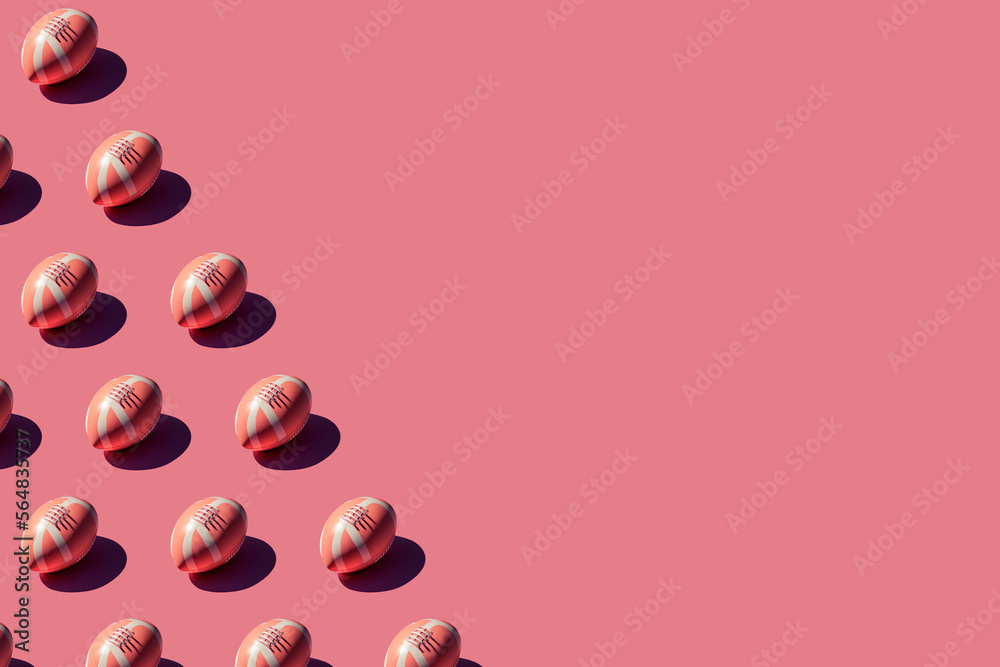 Pattern of pink American football rugby balls with hard shadow,on the ...