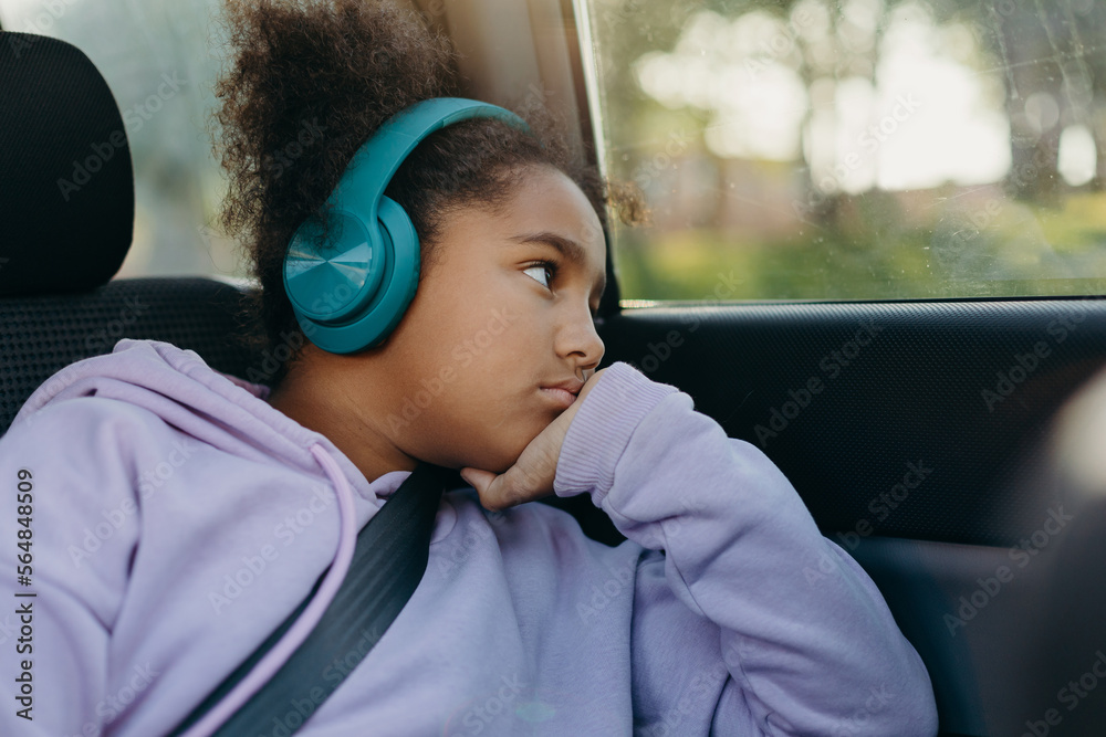 Bored black girl riding in car to school Stock Photo | Adobe Stock