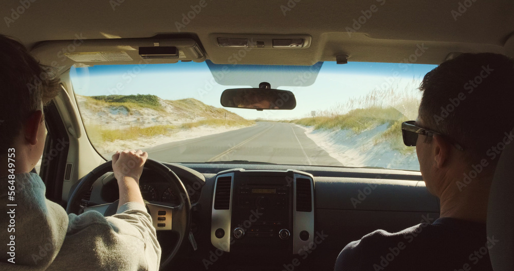 Teenage Boy Driving Car with Dad Stock Photo | Adobe Stock