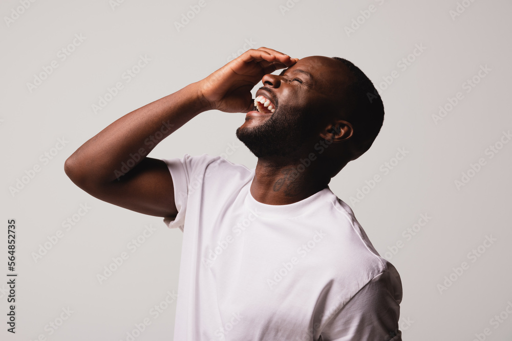 Cheerful black man laughing on white background Stock Photo | Adobe Stock