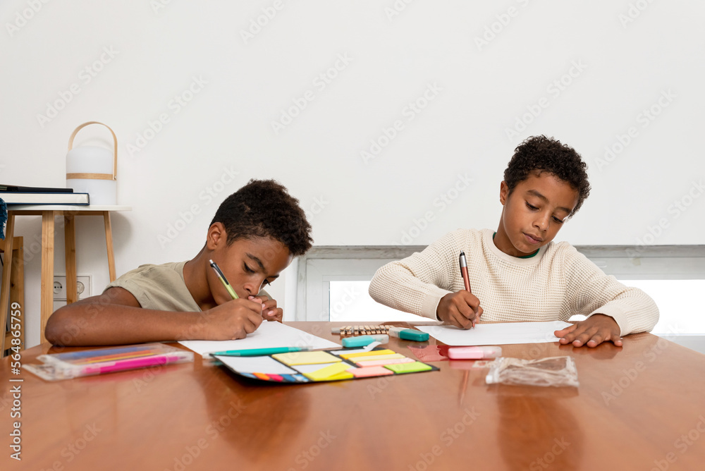 Two boys drawing after school Stock Photo | Adobe Stock