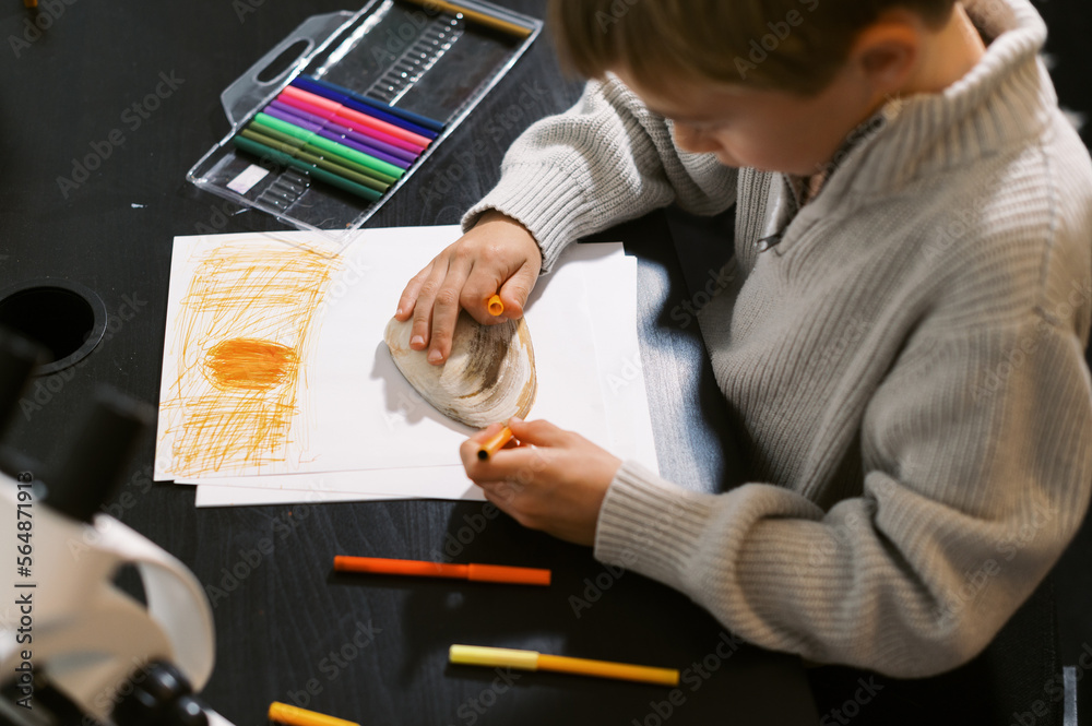 little kid drawing at his desk Stock Photo | Adobe Stock