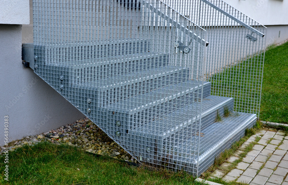 Stairs to a residential building made of stainless steel grid ...