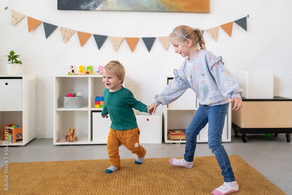 two kids playing in preschool room Stock Photo | Adobe Stock